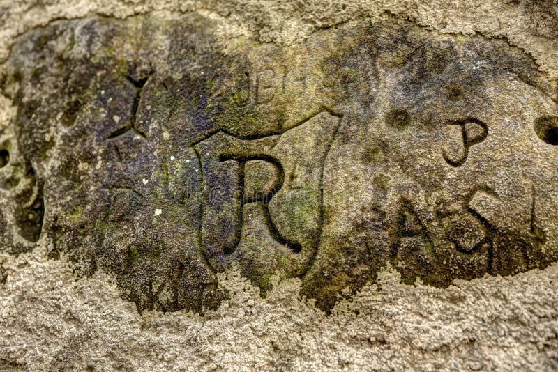 Letter R in the stone stock photo. Image of moss, rock - 55596664