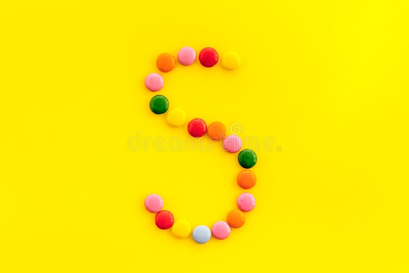 Letter S - Alphabet Made with Sweets on Yellow from Above Stock Image ...