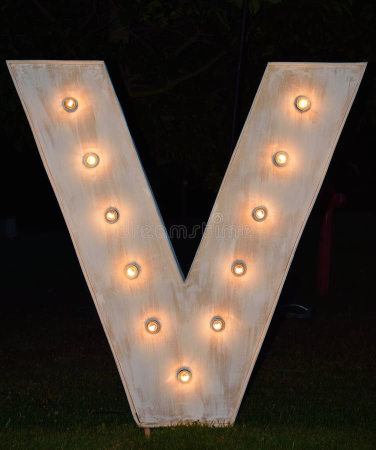 Letter V stock image. Image of grass, background, illuminated - 58323915