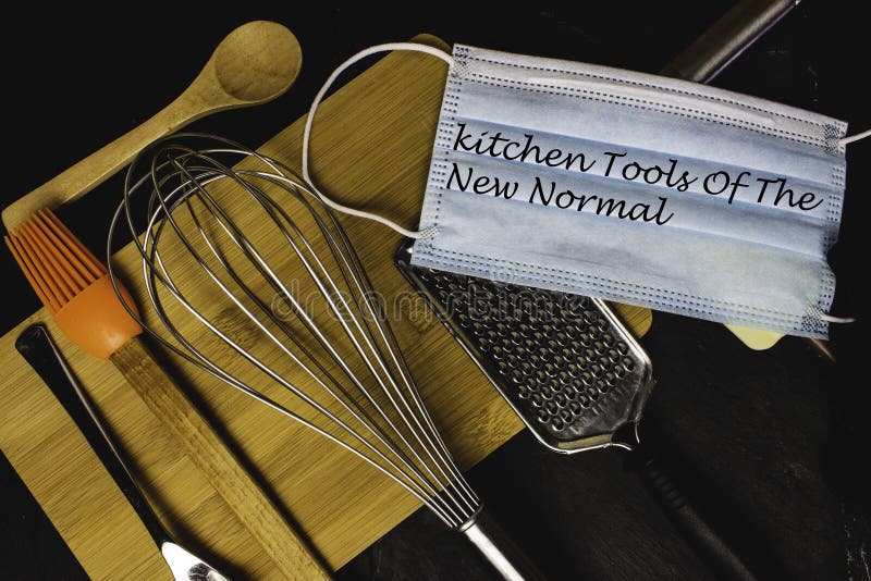 Lettering of the New Normal on Kitchen Utensils and Tools. Face Mask in ...