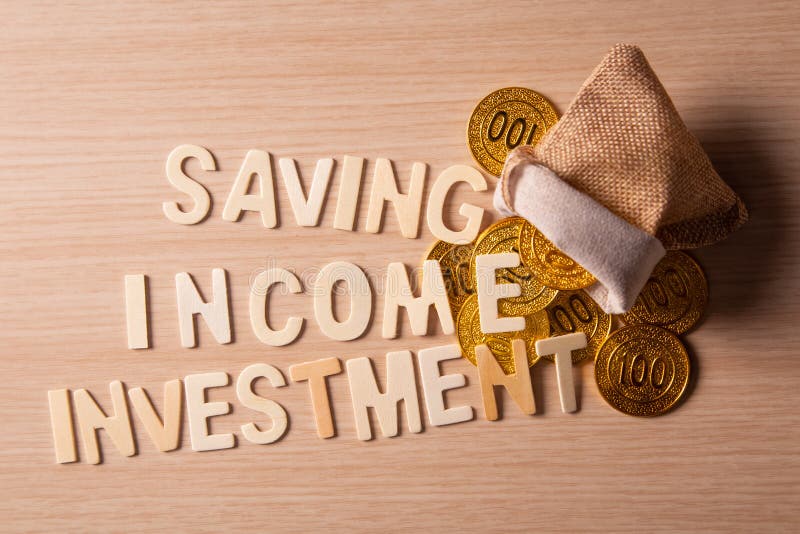 Lettering ` SAVING INCOME INVESTMENT with Coins Stock Photo - Image of ...