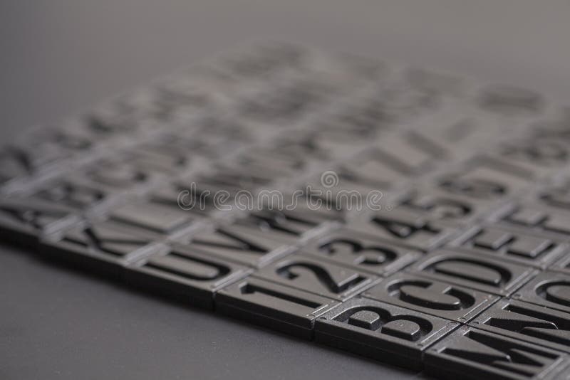 Letterpress Alphabet and Numbers on Black Background Stock Image ...