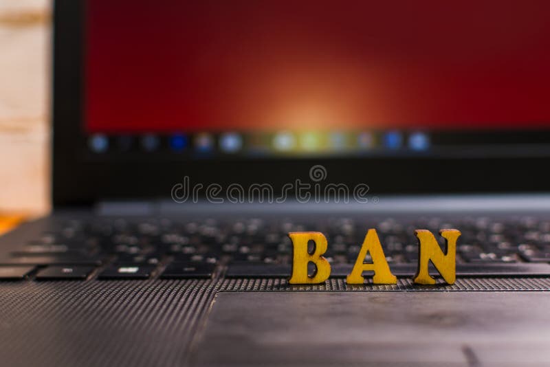 Letters BAN on the Laptop Keyboard Stock Image - Image of wooden ...
