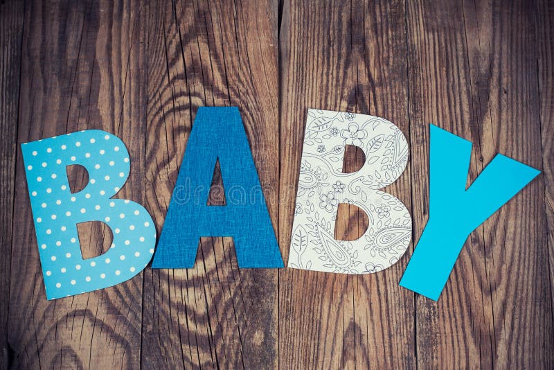 Letters of Word Baby and Knitted Socks Hanging on Clothesline Stock ...