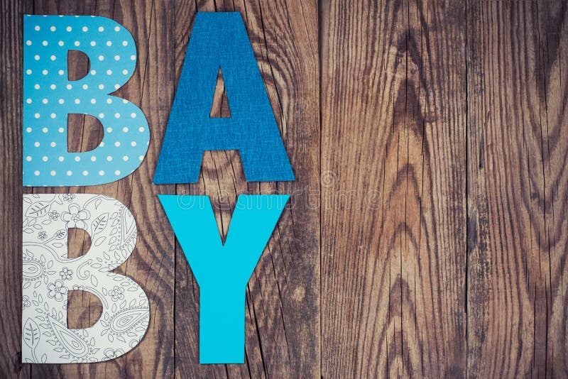 Letters of Word Baby and Knitted Socks Hanging on Clothesline Stock ...