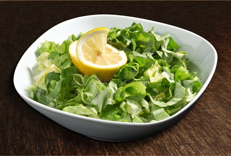 Lettuce salad with lemon stock image. Image of garnish - 24612605