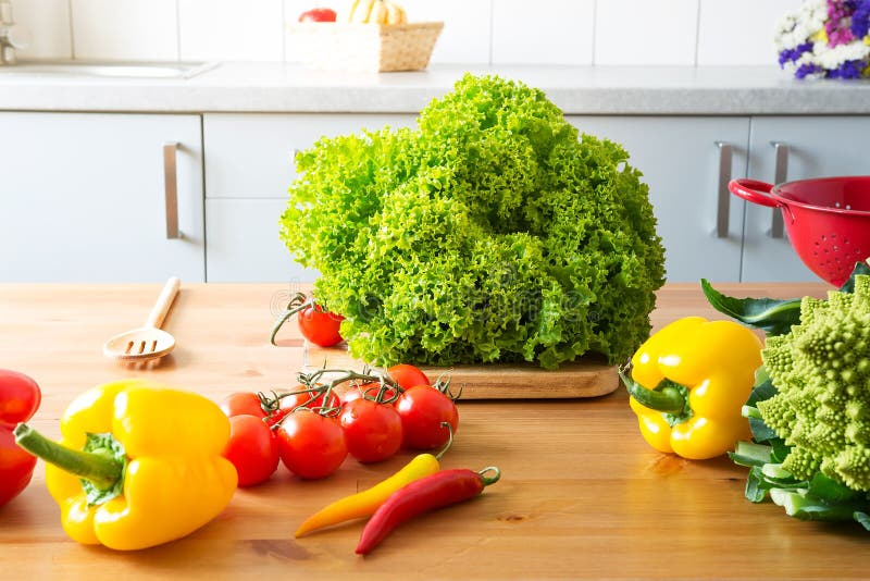 Lettuce on the Table with Vegetables in the Kitchen Stock Image - Image ...