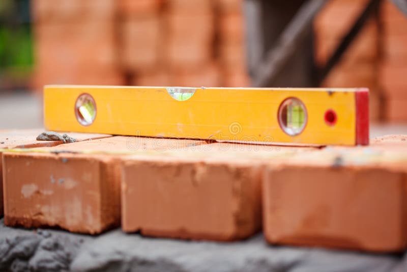 Level on bricks stock image. Image of construction, back - 50243427