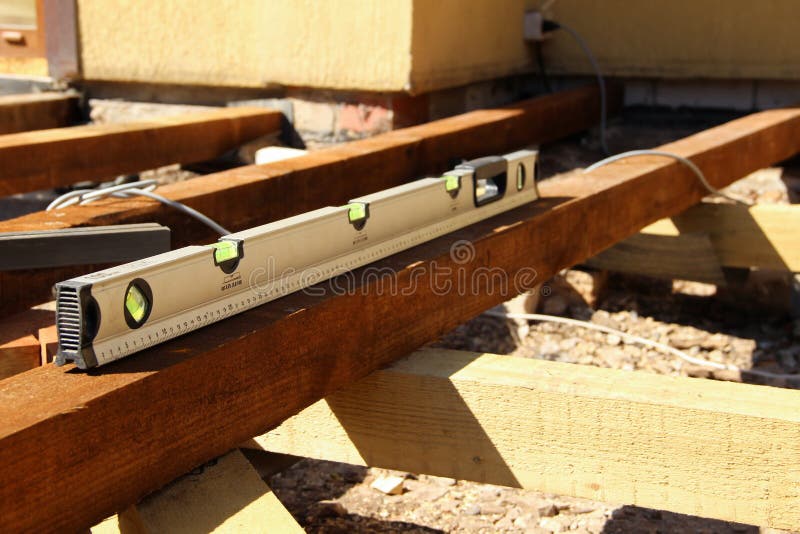 Level Check of Wooden Beam. Building Level in Use Stock Image - Image ...