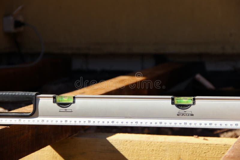 Level Check of Wooden Beam. Building Level in Use Stock Image - Image ...