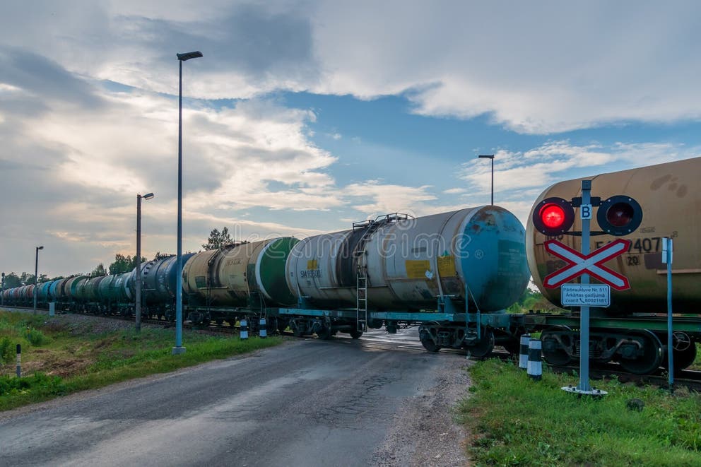 A Level Crossing is Closed, Wagons are Running on the Tracks Editorial ...