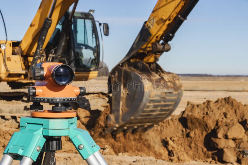 Level with an Excavator in the Background. Construction Level or ...