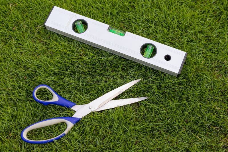 Cutting the Grass with Scissors and Using the Level Tool To Level the ...