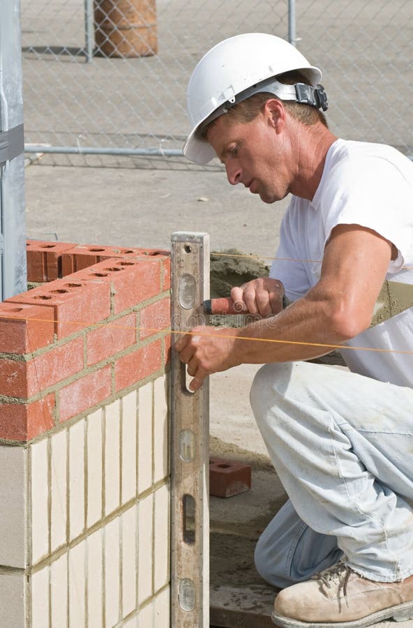 Leveling Bricks stock image. Image of laborer, inspecting - 7001159