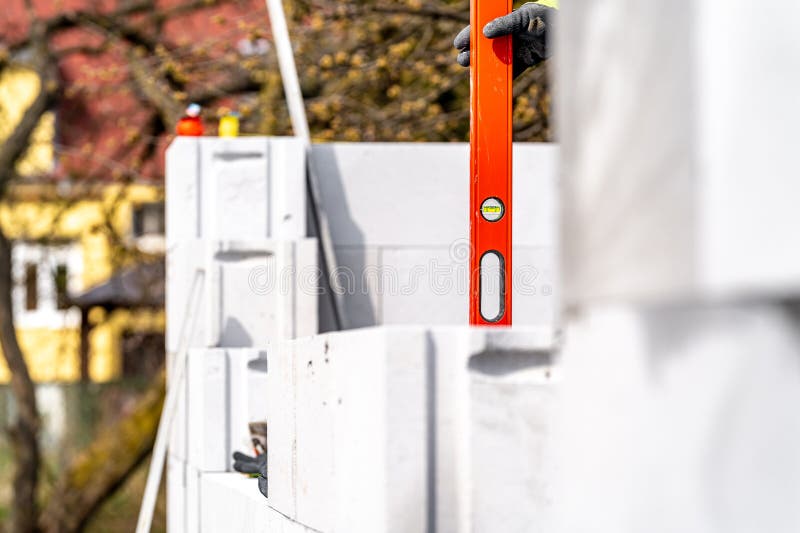 Leveling Bricks with the Help of a Spirit Level during the Construction ...