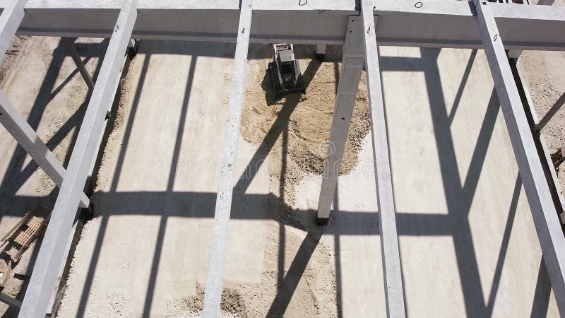 Leveling and Compaction of Soil on the Construction Site. Modern Mini ...