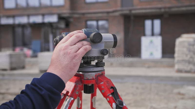 Leveling on the Construction Site in the Hands of the Engineer Stock ...