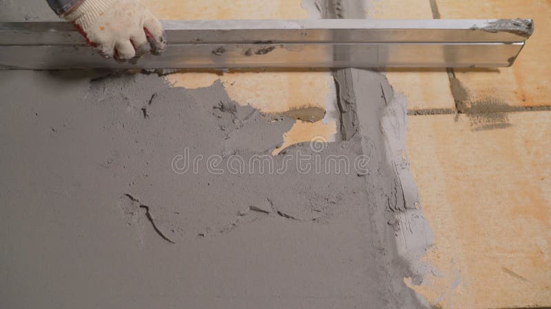 Leveling the Wall with a Finishing Putty. Leveling the Mortar on the ...