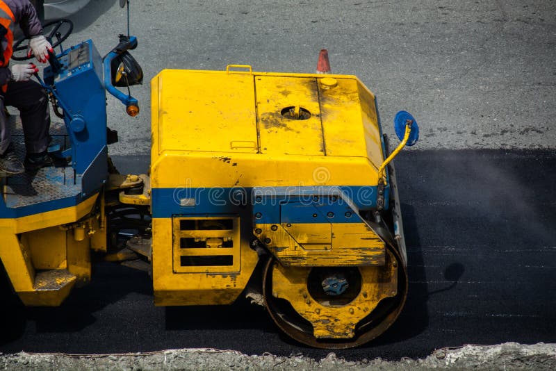 Leveling of New Layer of Asphalt by Road Roller. Stock Photo - Image of ...