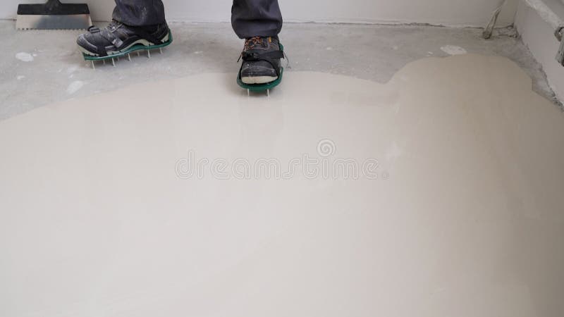 Leveling the Solution, Self-leveling Liquid Floor. the Worker Pours the ...