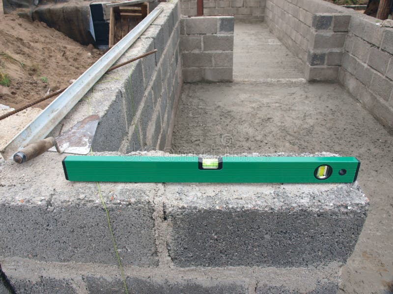 Leveling the Wall with a Laser Level. Lighted Laser Level. Display ...