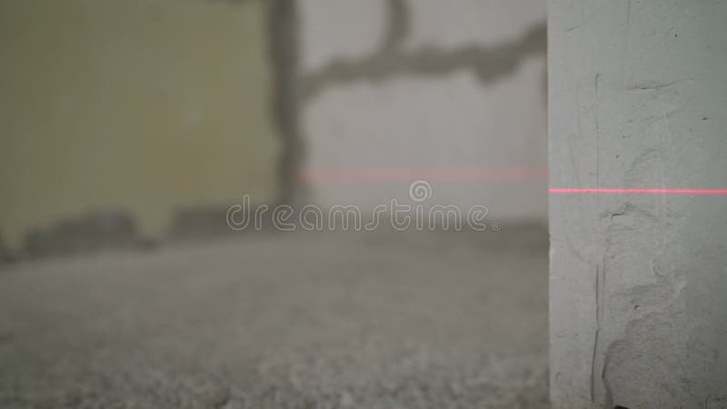 Leveling the Wall with a Laser Level. Lighted Laser Level. Display ...