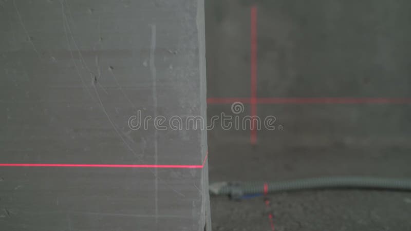 Leveling the Wall with a Laser Level. Lighted Laser Level. Display ...
