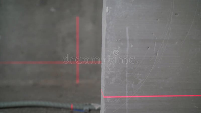 Leveling the Wall with a Laser Level. Lighted Laser Level. Display ...