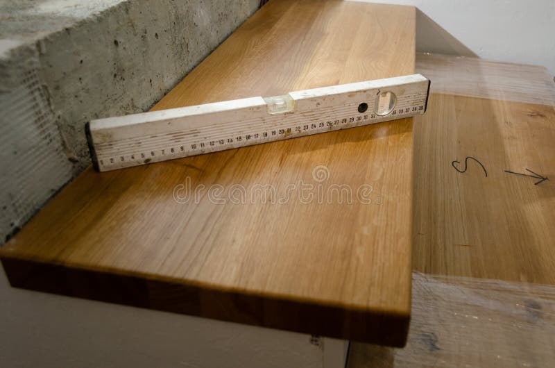 Levelling Oak Stairs with Balance Water Tool Stock Photo - Image of ...