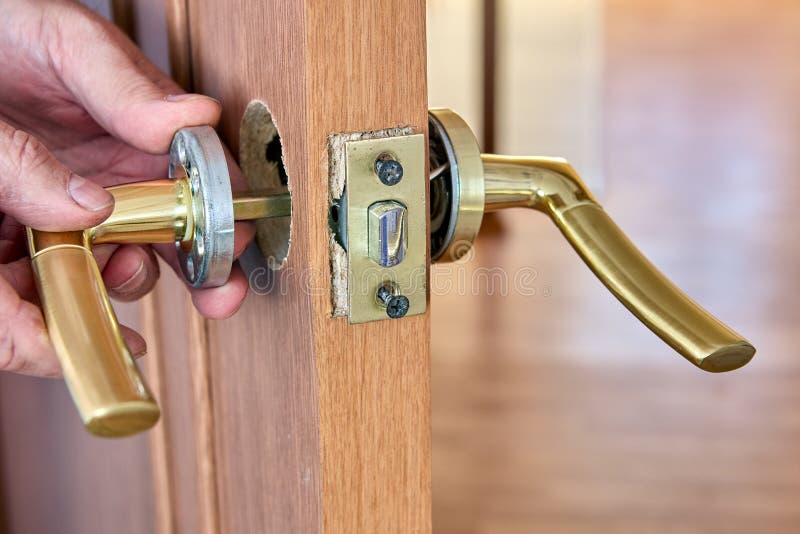 Lever Door Handle Pin is Inserted into Door Latch Hole during ...