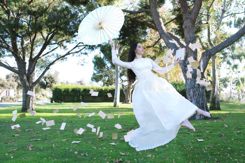 Levitation Girl Outdoors with Book Pages Flying Stock Image - Image of ...