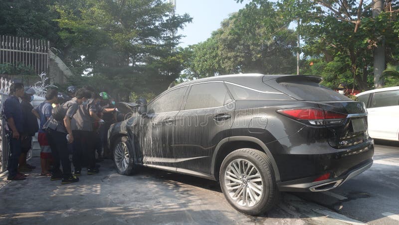 A Lexus car caught fire editorial stock photo. Image of extinguisher ...