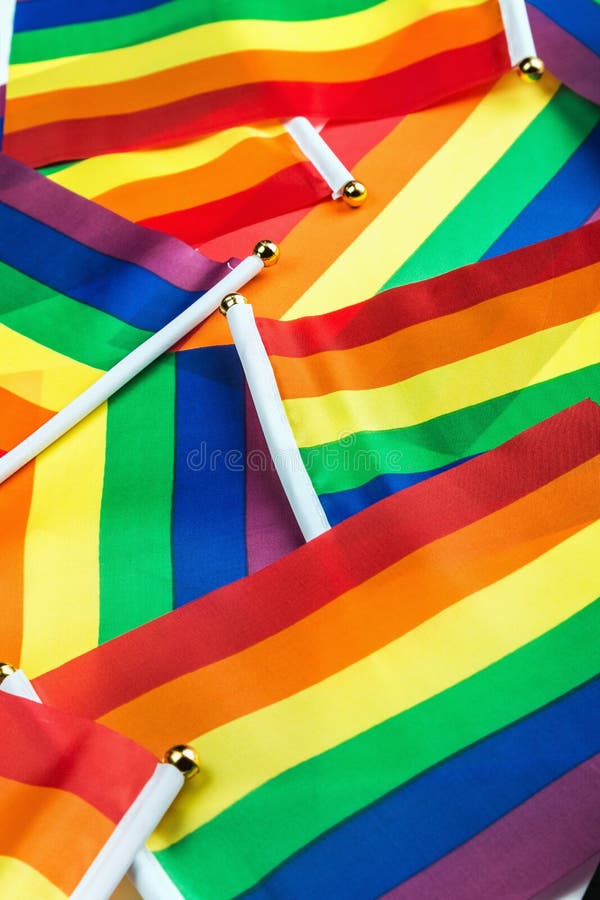 Flags of the LGBT Community on a Blue Stock Photo - Image of orange ...