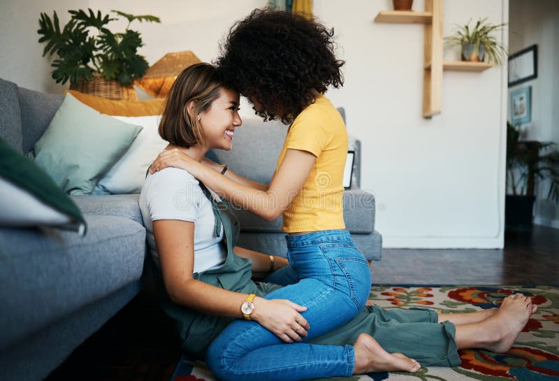 Lgbtq Couple And Love With Hug On A Living Room Floor In New Home With