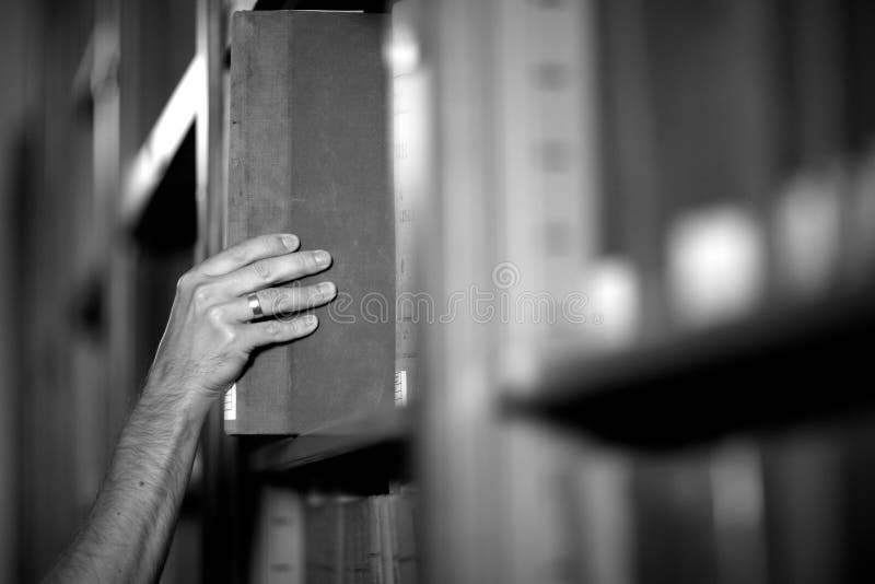 Librarian Taking a Book from Stock Photo - Image of searching, novel ...