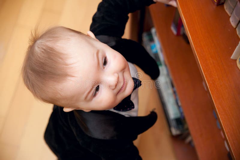 In the library stock image. Image of baby, indoors, tuxedo - 8654657