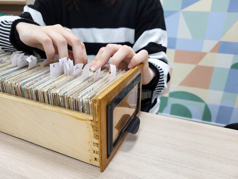 The Library Drawer and the Hands with the File Cabinet are on the Table ...