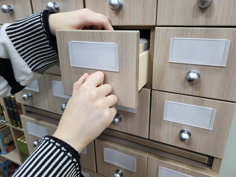 Library Drawers with Filing Cabinets and Hands Stock Photo - Image of ...