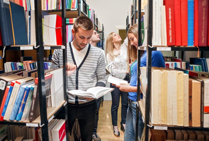 Multiracial Group of Friendly People Chatting in Library Stock Photo ...