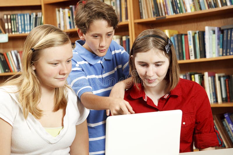 Library Kids on Computer stock photo. Image of reading - 18729620