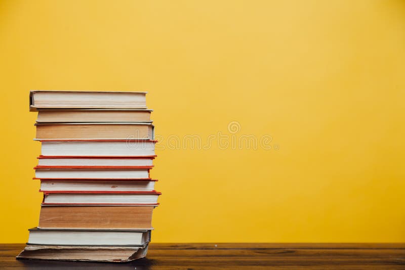 Library of Many Books for Learning on a Yellow Background Stock Photo ...