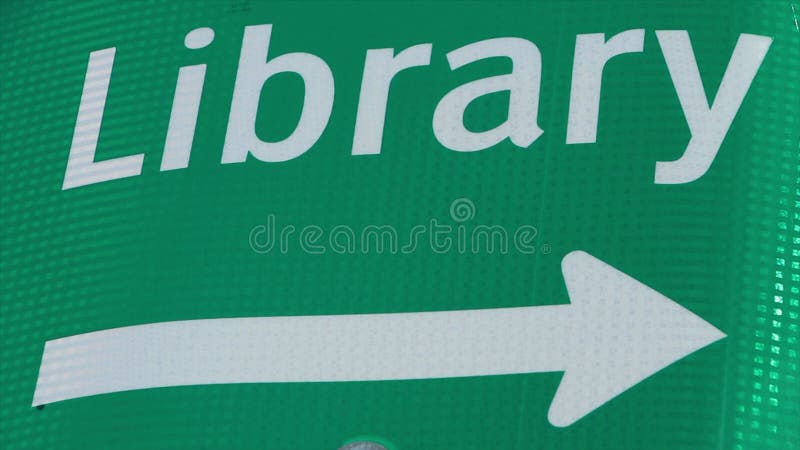 Library Metal Sign in White Writing on Green Background with Arrow ...
