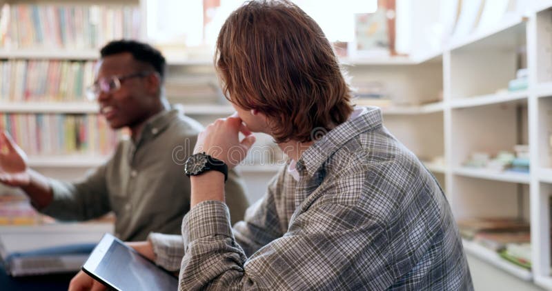 Library, Study and Student Man Listening To Group Conversation and Book ...
