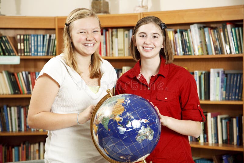 Library Teens with Globe stock image. Image of girl, bookshelves - 16612031