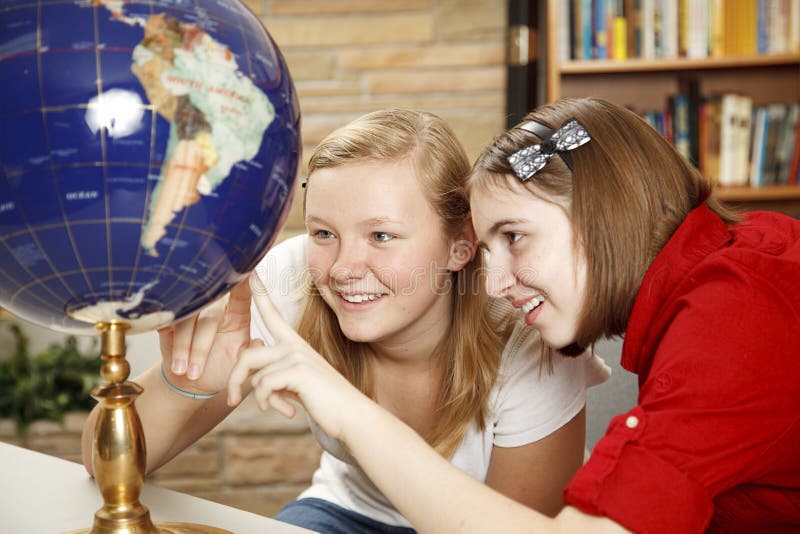 Library Teens Looking at Globe Stock Image - Image of pretty, library ...