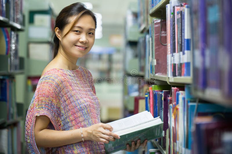 Library ,women student stock image. Image of school, tablet - 65659295