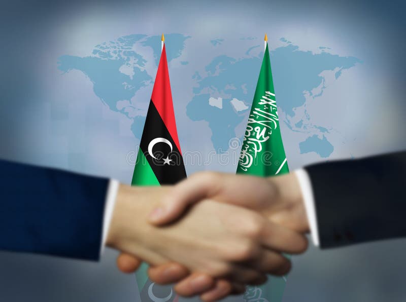 Two People Shaking Hands in Front of Saudi Arabia and Libya Flags Stock ...
