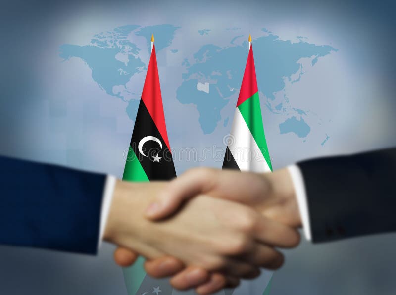 Two People Shaking Hands in Front of UAE and Libya Flags Stock ...