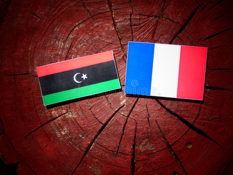 Libyan Flag with French Flag on a Tree Stump Isolated Stock Photo ...