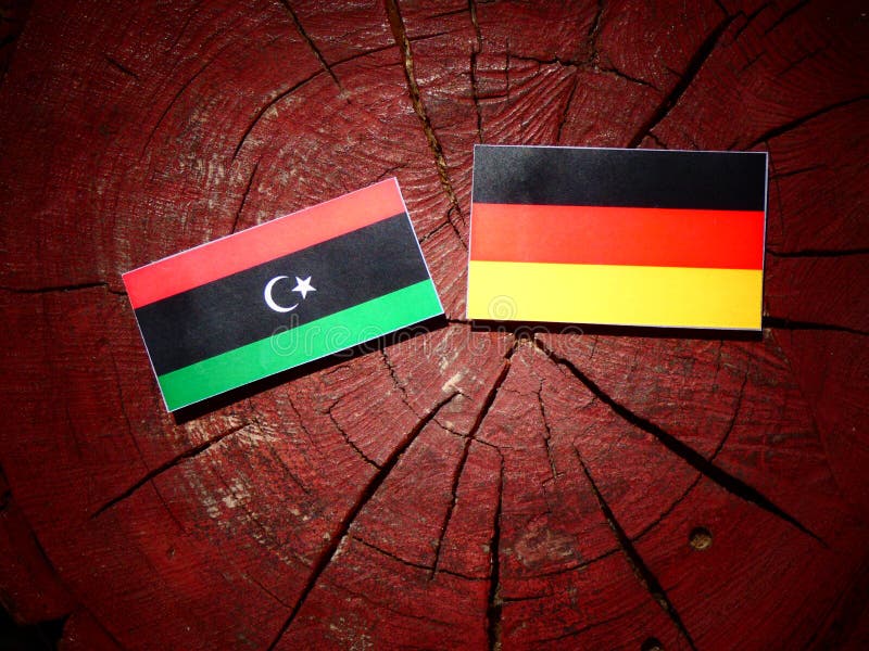 Libyan Flag with German Flag on a Tree Stump Stock Image - Image of ...